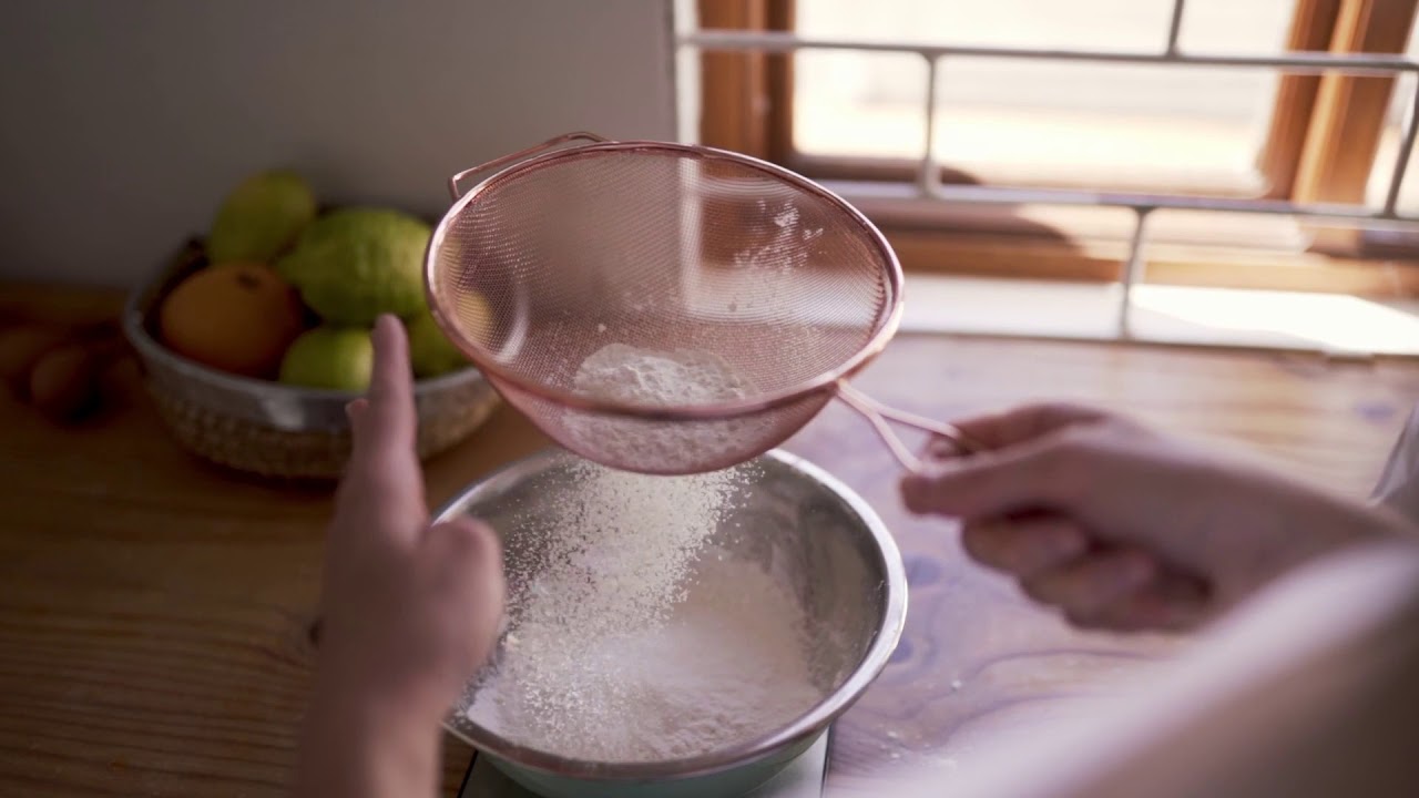 Straining The Flour To Be Used In Baking - YouTube