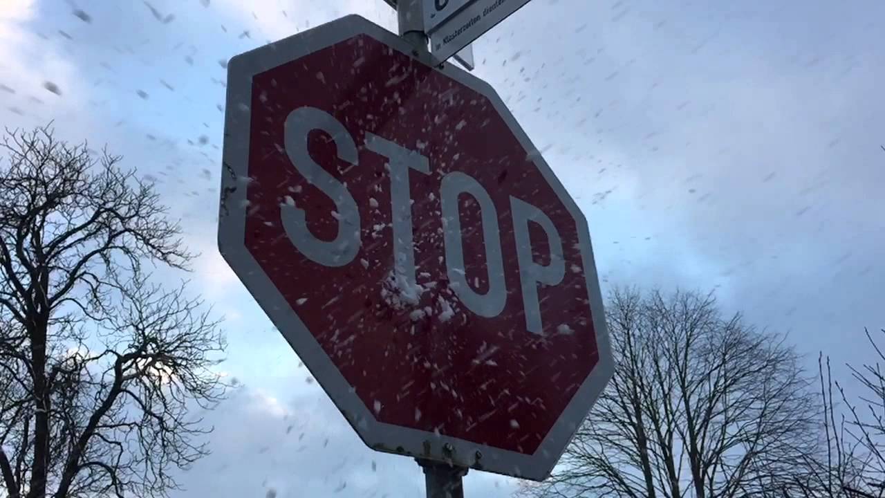 STOP sign hit by snow - YouTube