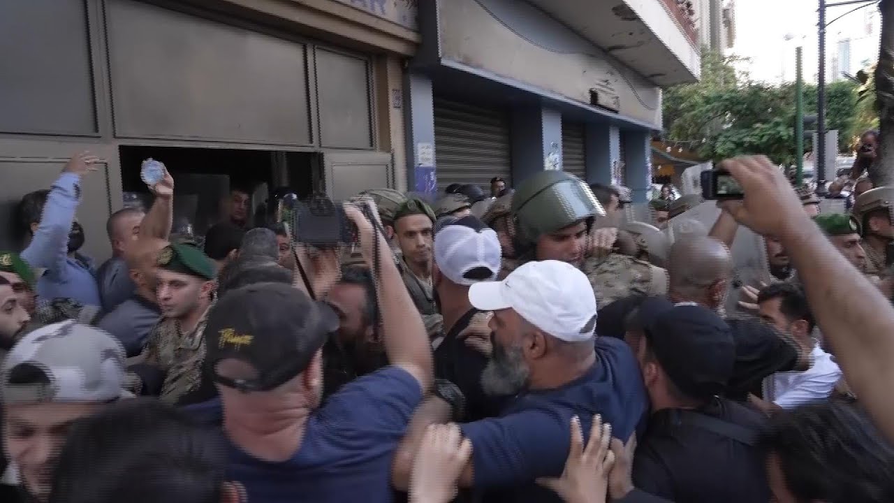 Scuffles break out after police officers forcibly evict displaced ...