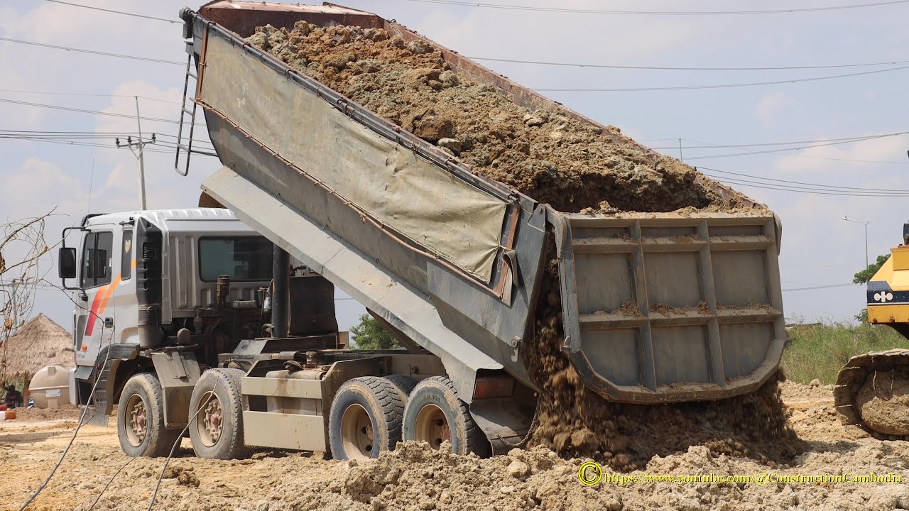 Extreme Heavy Dump Trucks Unloading Dirt & Komatsu D53P, D58P Bulldozer ...