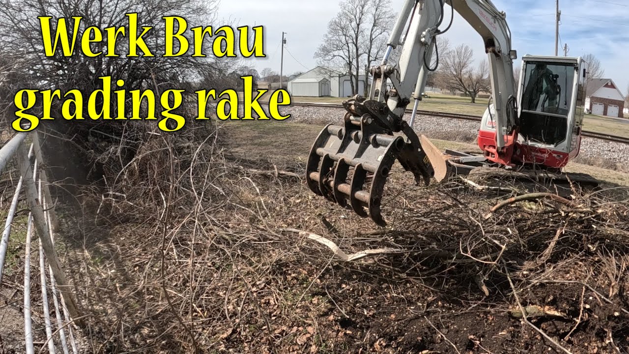 Using The Werk Brau Grading Rake To Remove Shrubs - YouTube