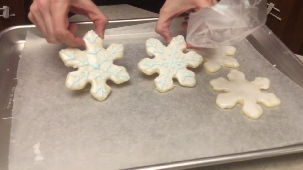 How to decorate a snowflake sugar cookie - YouTube