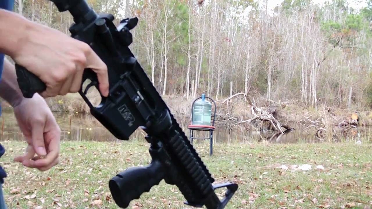 AR-15 XM856 5.56x45mm vs. Water Jug - YouTube