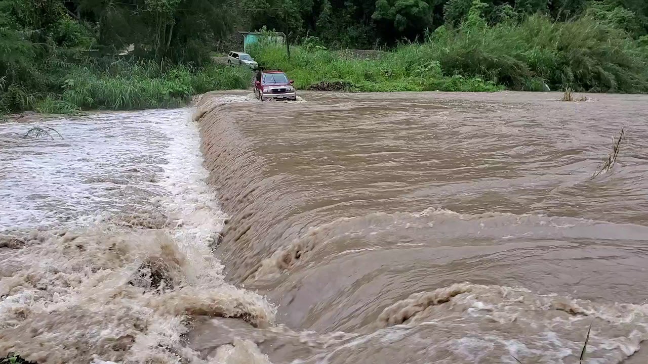 Ivory Ja Driving through yallahs river on nobody cannot cross it bridge ...