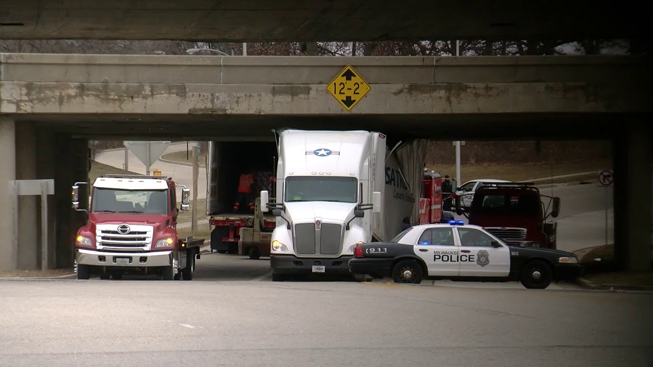 Semi truck stuck under I-94 bridge on Mitchell Blvd. - YouTube