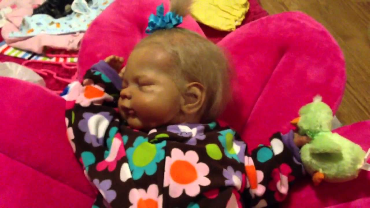 The new reborn baby in her cute pajamas and a bottle feeding - YouTube