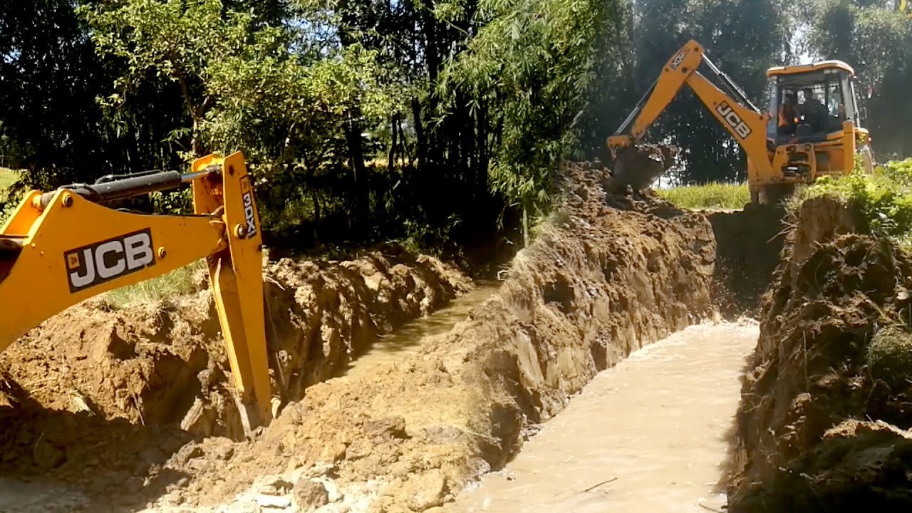 JCB Backhoe Machine Making Diversion Of River For Bridge Construction ...