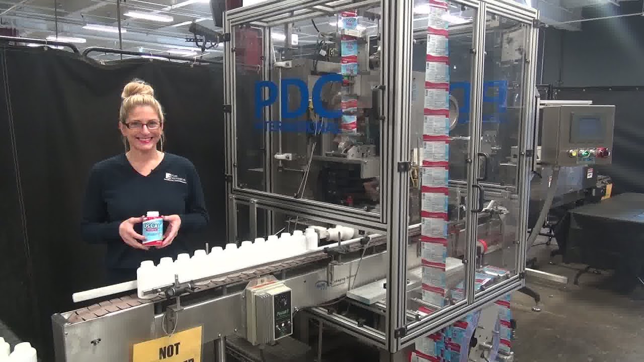 PDC Automatic Sleever/Neck Bander Demonstration - YouTube