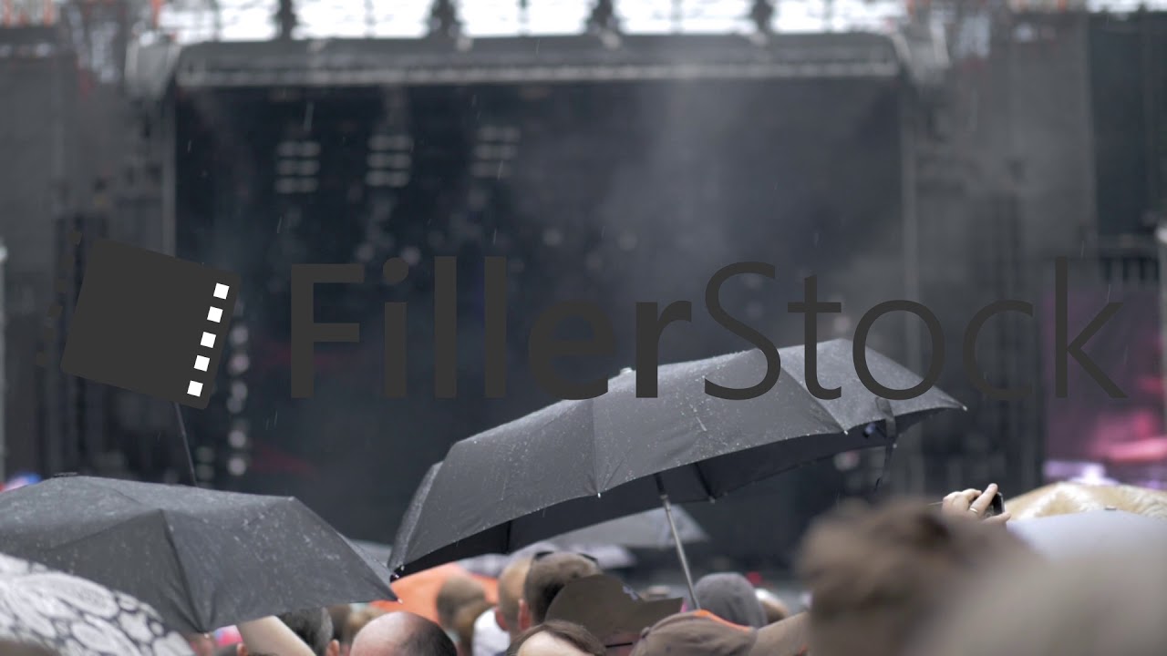 People at outdoor concert under the rain - YouTube