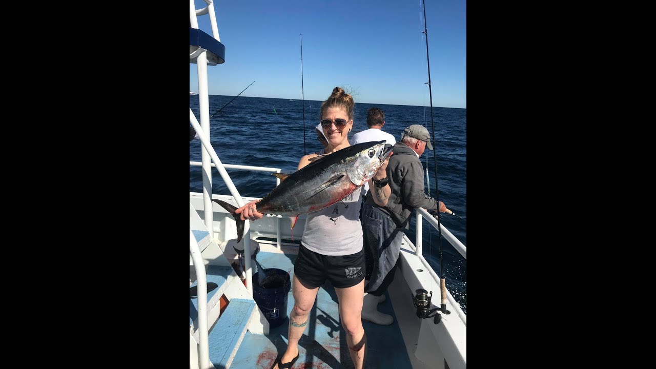 FISHERWOMAN BATTLES BLUE FIN TUNA ON LIGHT SPINNING GEAR - YouTube