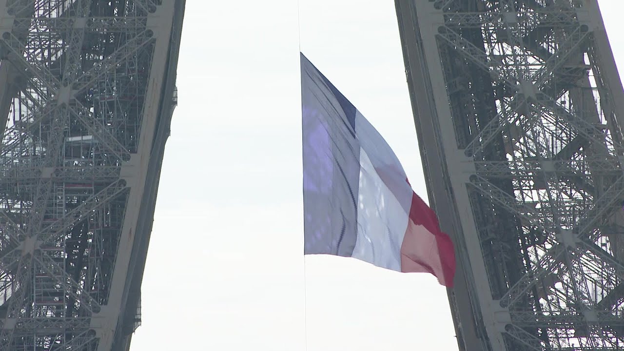 Large French flag hangs from Eiffel Tower to mark 75 years since end of ...