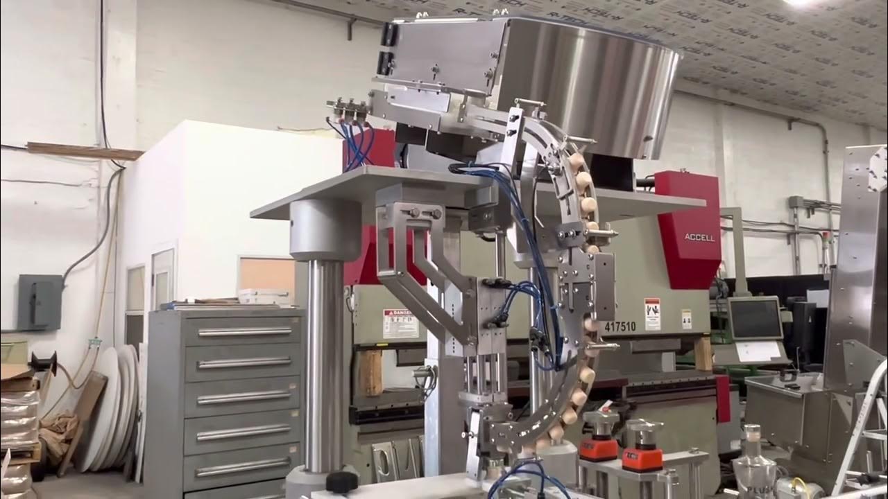 t-cork-automatic-machine-placing-t-corks-on-750-ml-liquor-bottle-by