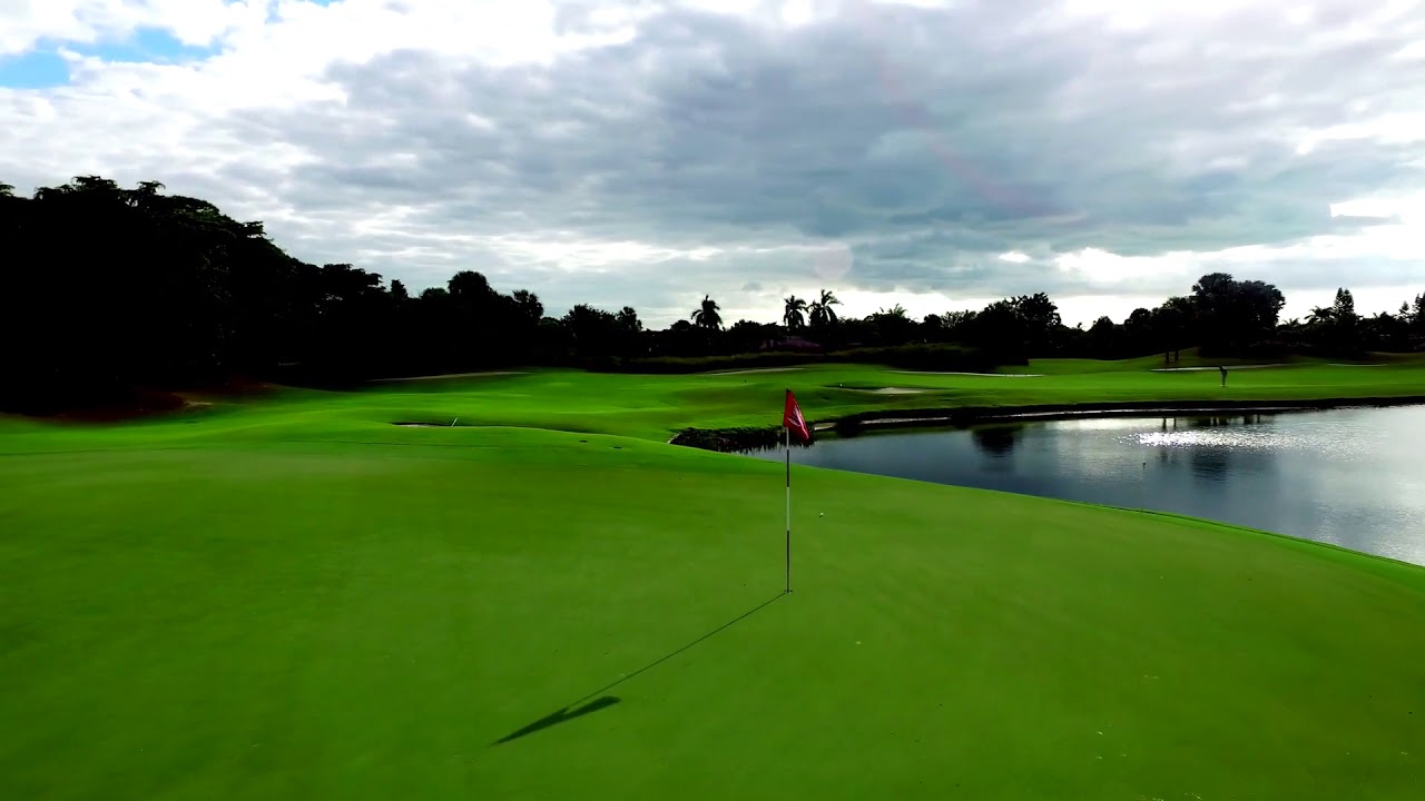 golf course with sand and water features by aerial drone - YouTube