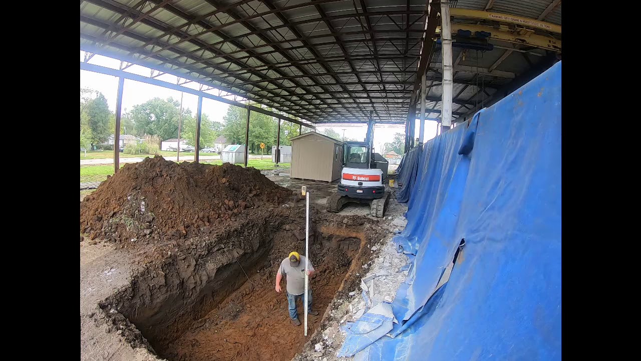 E50 Bobcat Digging A Mechanics Pit - YouTube