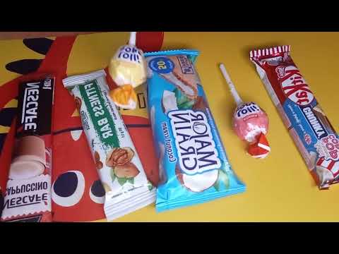 Some Lot's of candies: milka chocolate VS mallows VS fitness bar VS biscuit