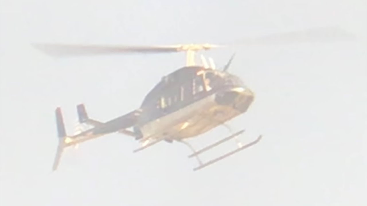 Noisy helicopter flying overhead : Bell 206 L4 Longranger IV VT-RBG ...