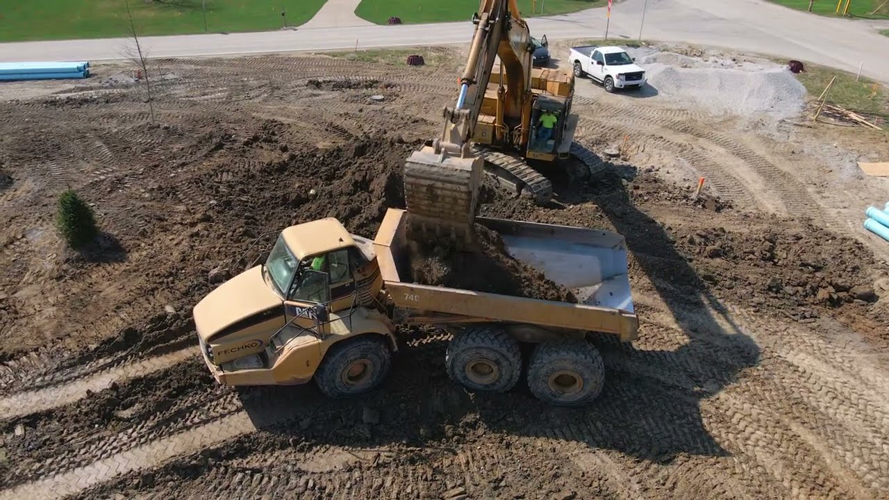 DRONE VIEW of Excavator Loading Dump Truck //Cat 740 Off Road Dump ...