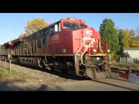 CN 2939, 3010, QGRY 1501 blast a Westbound freight train with CC open hoppers past Vicksburg, MI ...