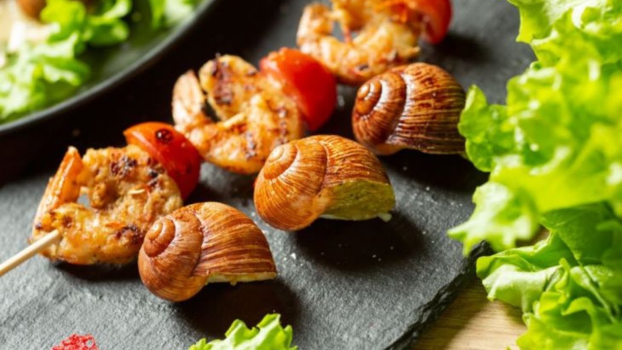 Tasting snails at the festival in the village of Tersefanou. A culinary ...