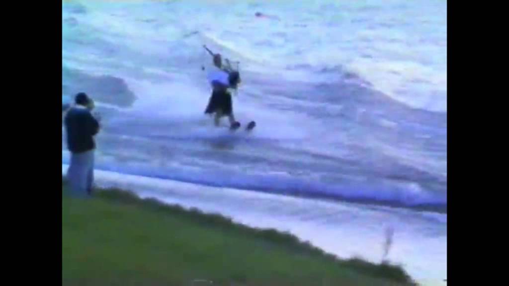 Bagpiper playing the pipes while water skiing - YouTube