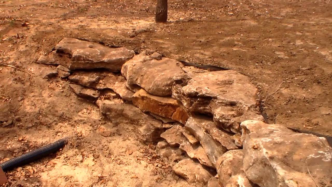 Boulder Wall Construction - YouTube