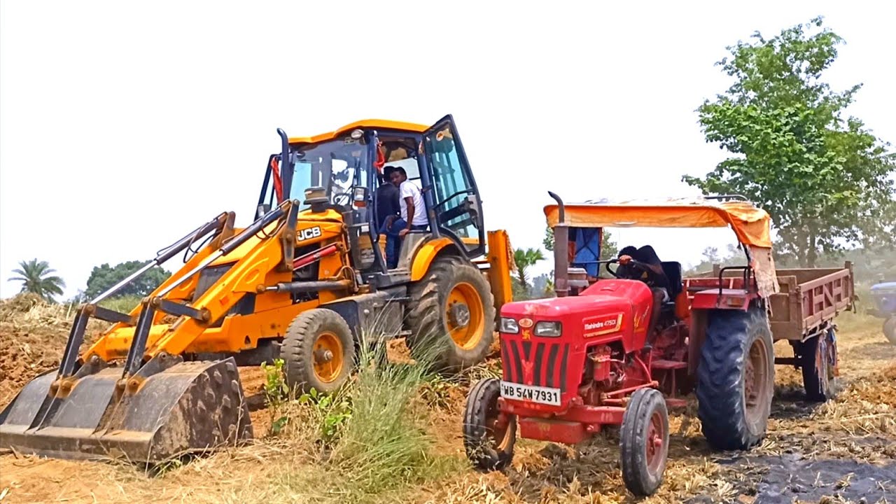 Jcb 3dx Backhoe Loader Machine Loading Red Mud In Mahindra 475 DI ...