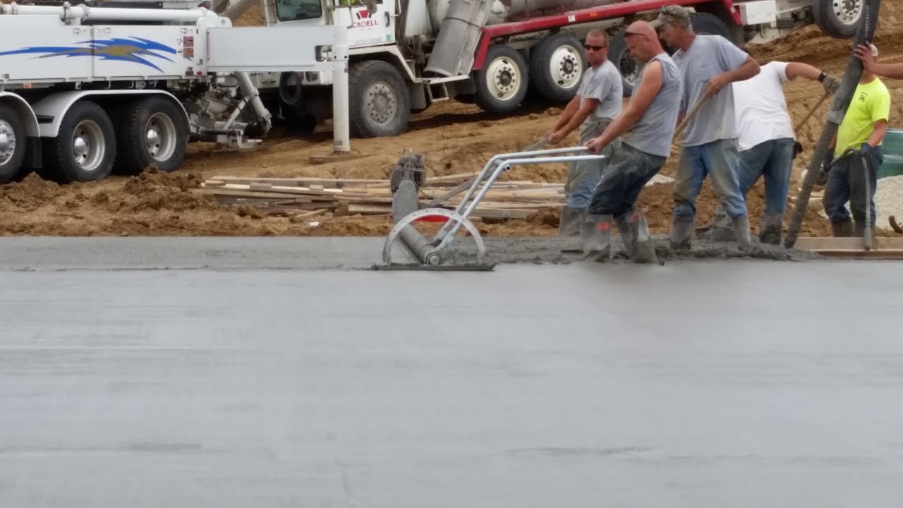 Amazing Sloped Pour struck off going down hill with Roller Screed and a ...