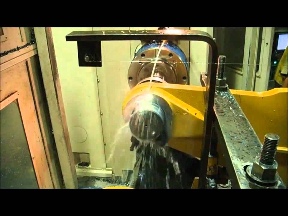 Steiner Autofacer performing back spotface on heavy equipment part ...