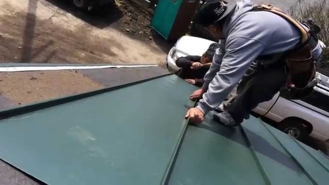 Metal roof panel install: By Jeff's Roofing - YouTube