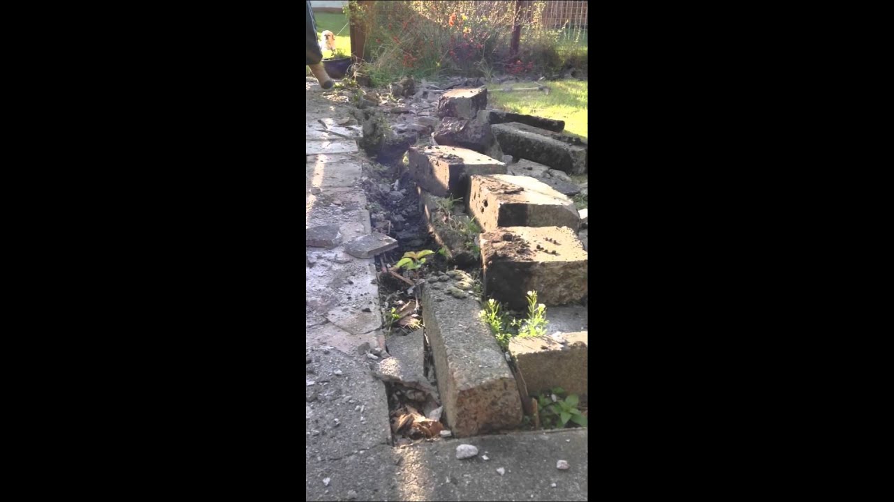 Digging up concrete path - YouTube