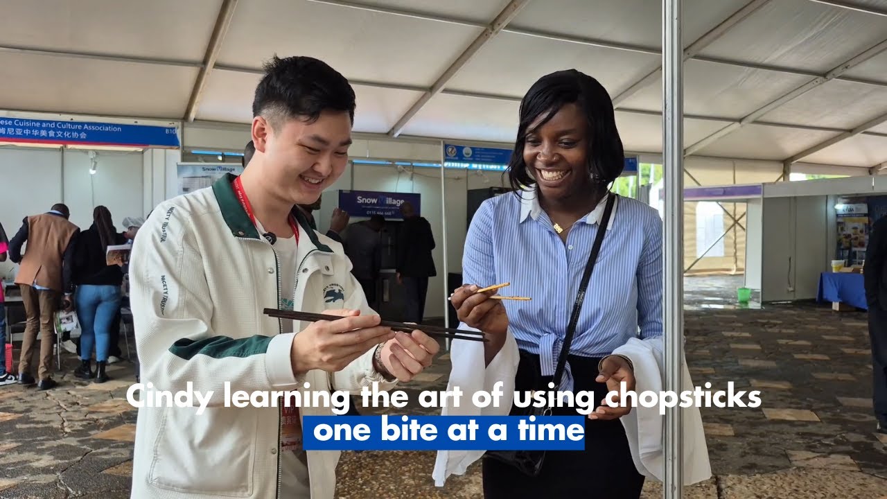 Cindy learning the art of using chopsticks — one bite at a time - YouTube