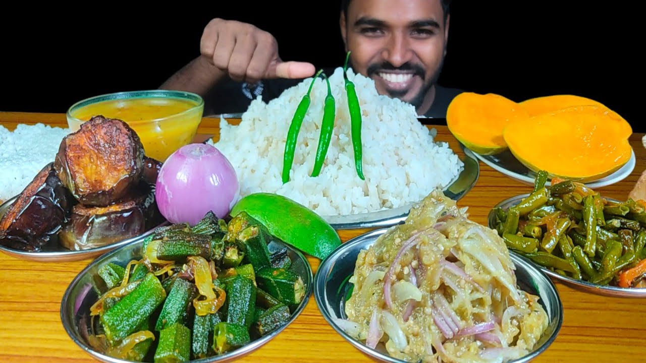 Eating Dal Chawal with Bhindi Bhaja, Baingan bharta, Barbati Bhaja ...