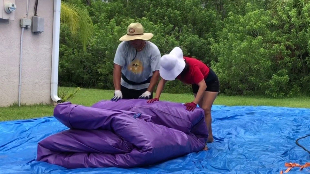 Roll up the bounce house combo - YouTube
