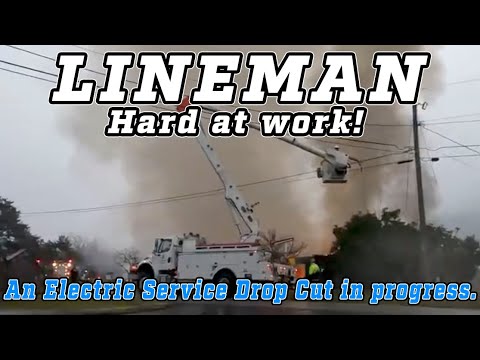 Lineman Hard at Work While Firefighters Battle a Fully Involved ...