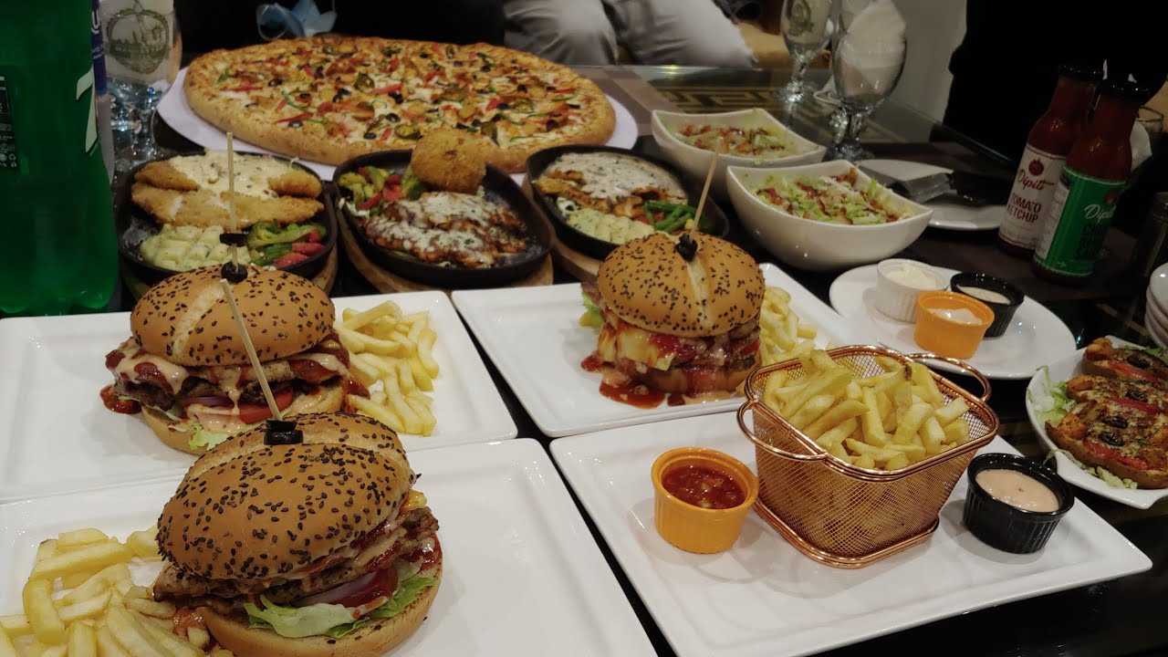 Trying ALL Of The Most Popular Menu Items At Manhattan Bites - YouTube