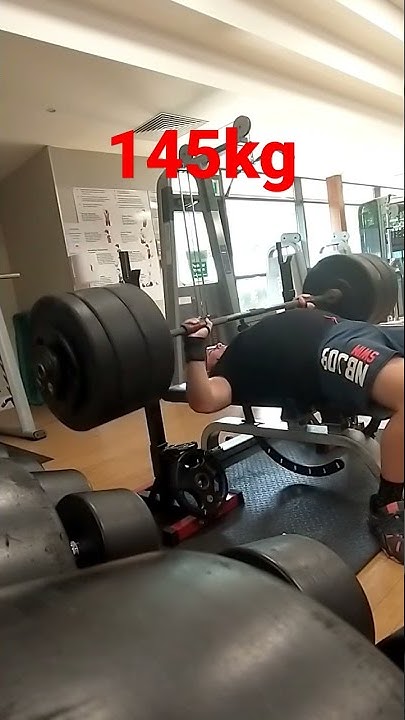 145kg bench press slight pause rep - YouTube