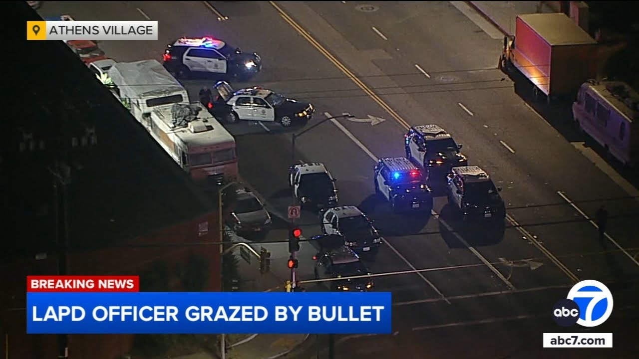 LAPD officer grazed by bullet during confrontation with suspect - YouTube