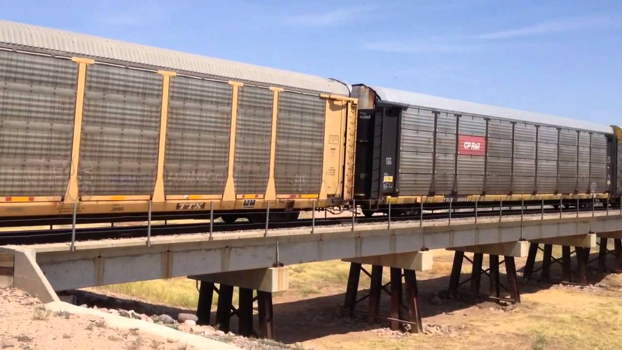 Union Pacific 4409 leads an auto rack with CSX power through Gilbert ...