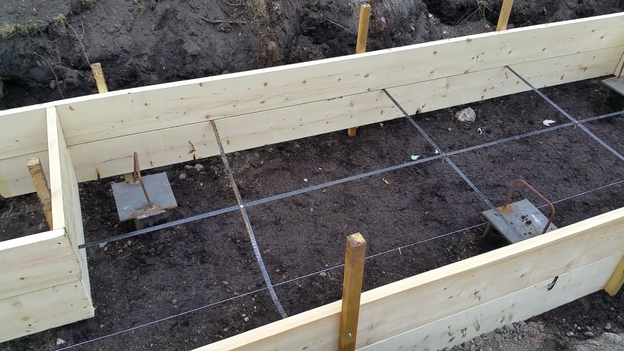 FORMS FOR THE GRADE BEAM SHOWING THE PILE CAPS - YouTube