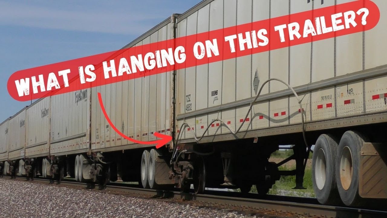 What is hanging from the side of this Roadrailer? and check out the UP locomotive! - YouTube