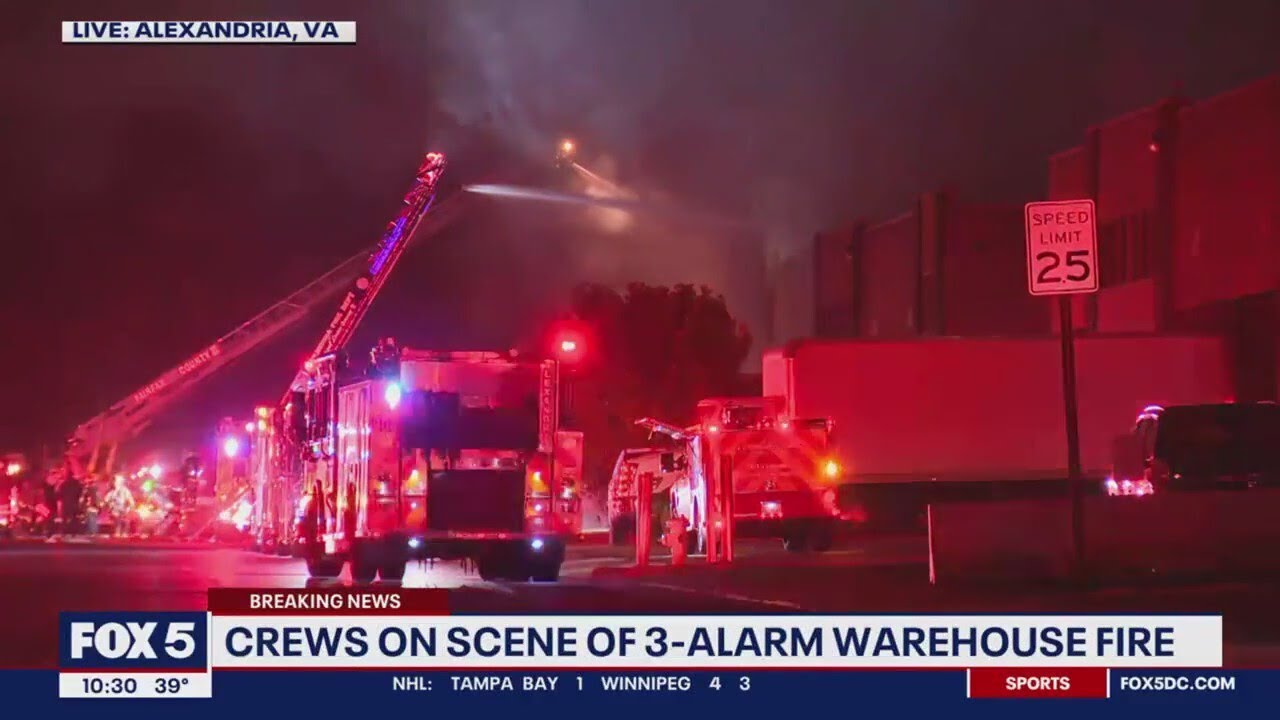 Fire crews battle warehouse fire in Alexandria - YouTube