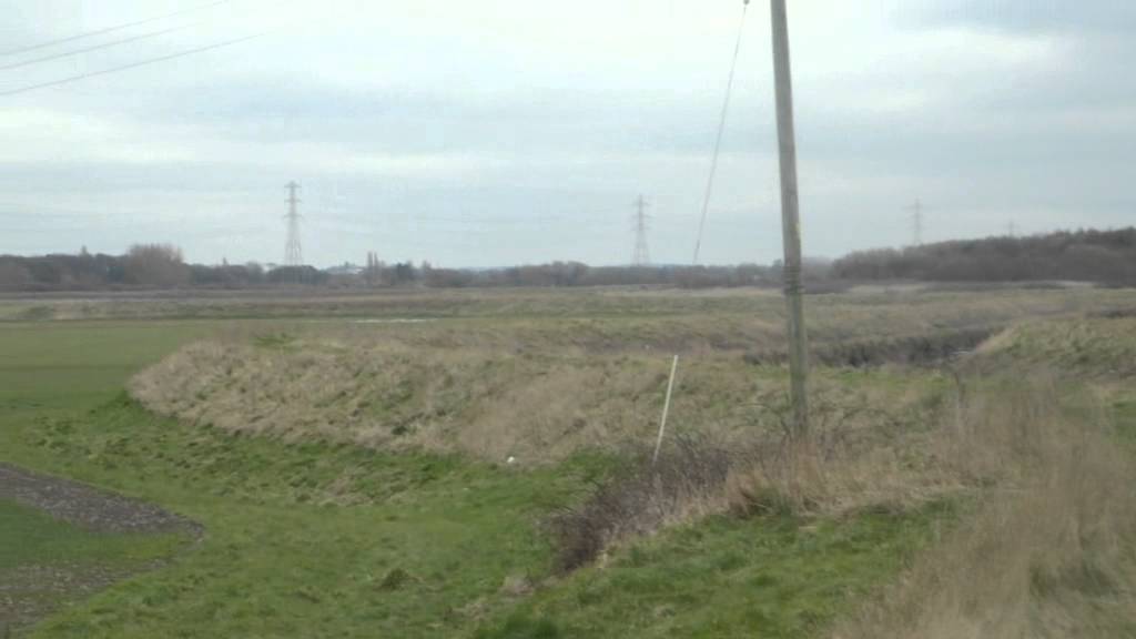 Lunt meadows wetland nature reserve , sefton church in the distance ...