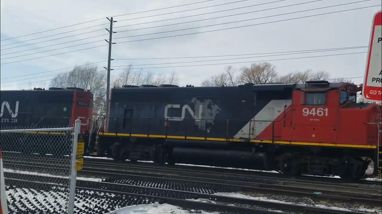CN L554 EMD GP38-2 7509 & GP40-2L 9461 are building up another Freight Train in Oakville Yard ...
