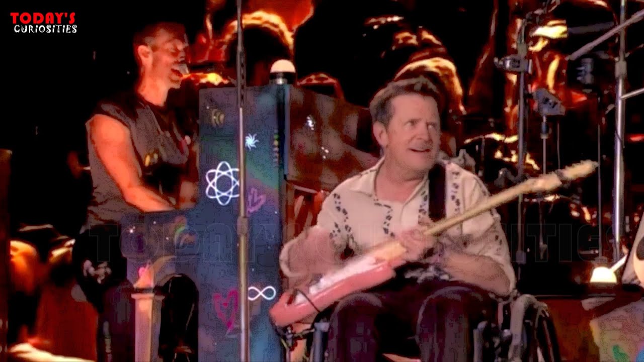 Michael J. Fox thrills crowd by playing guitar in wheelchair with ...