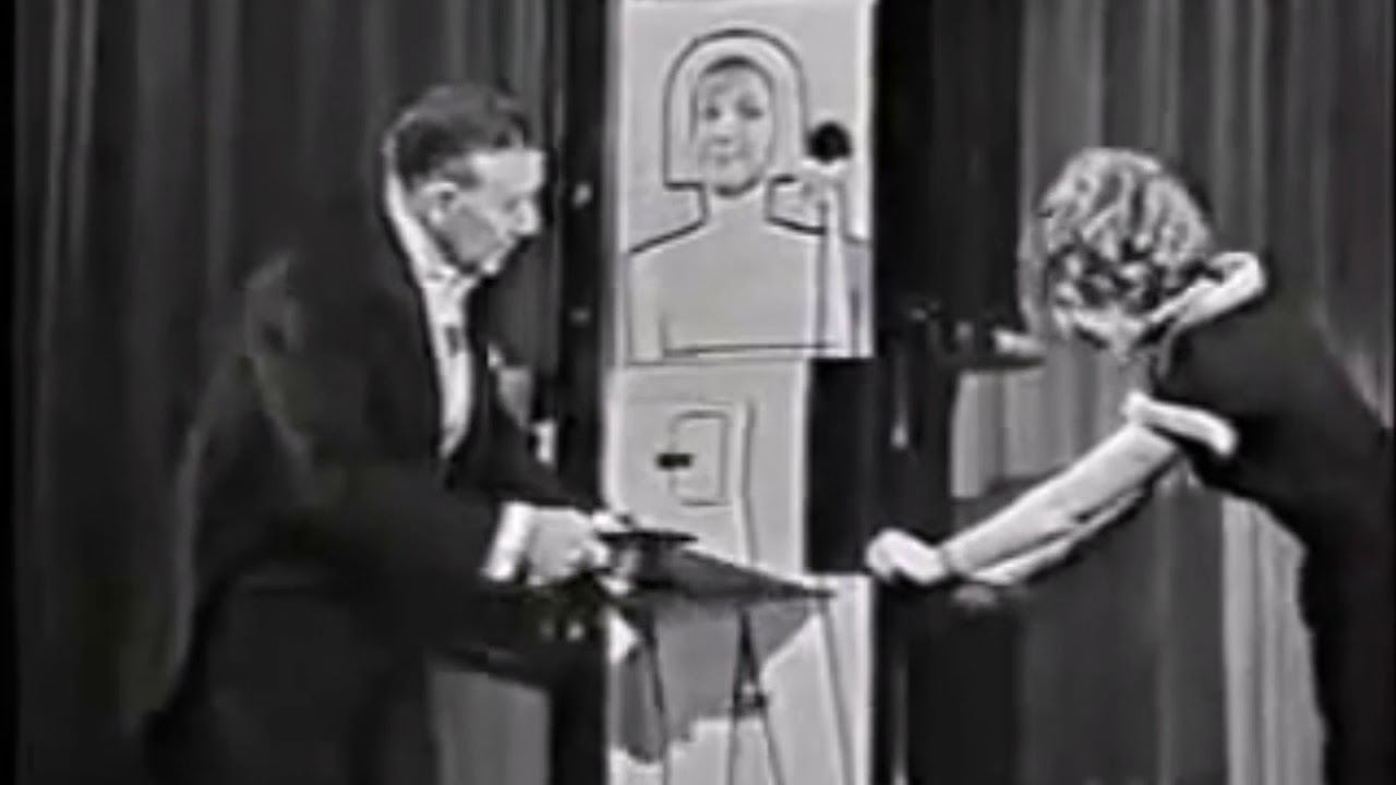 Robert Harbin performs his invention, Zig Zag Illusion. - YouTube