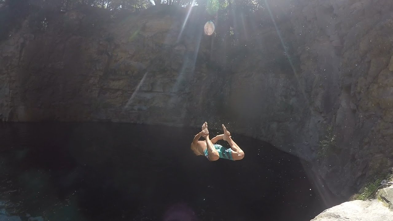CRAZY CLIFF JUMPING AT A ROCK QUARRY - YouTube