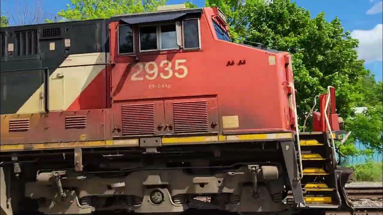 CN 2935, GECX 2049, CN 5707 speed a Westbound train with TOKAI carbon hoppers over Vicksburg, MI ...