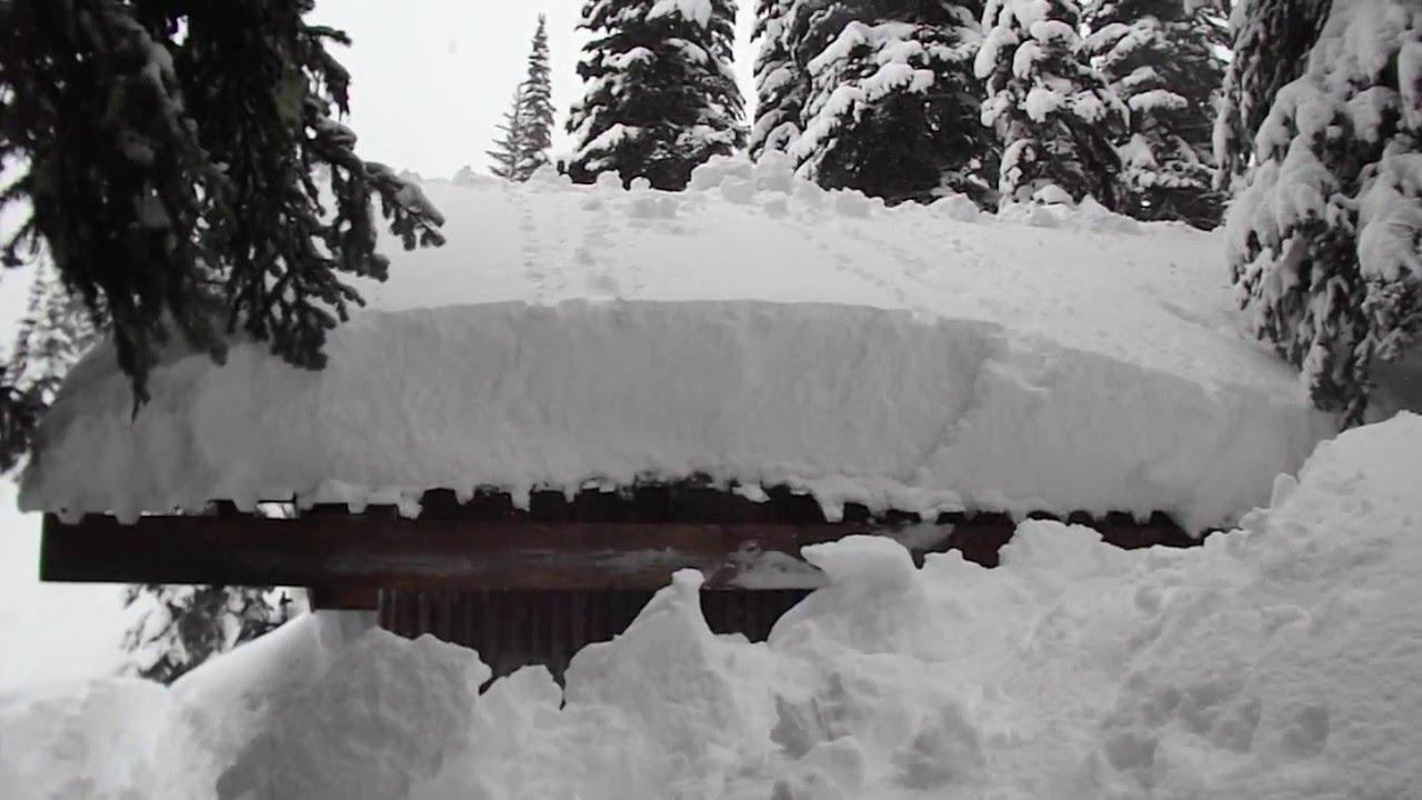 snow slide off cabin roof - YouTube