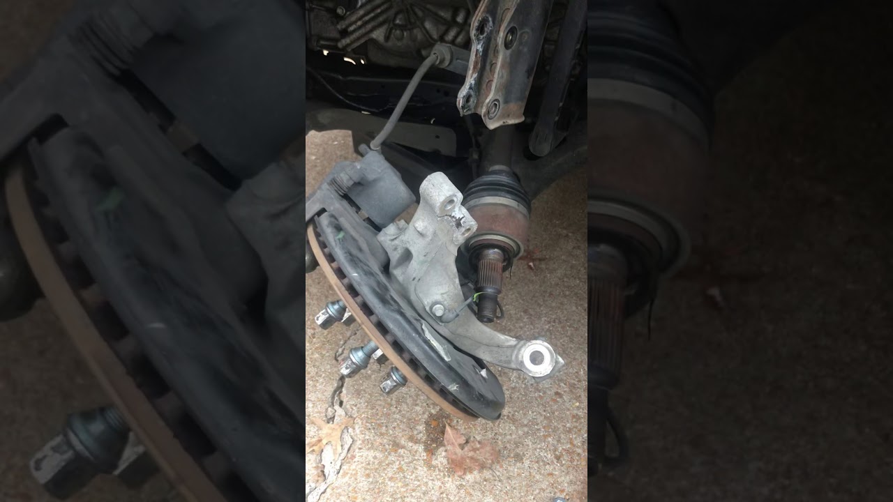 Axle replacement on a 2017 Chevy impala - YouTube