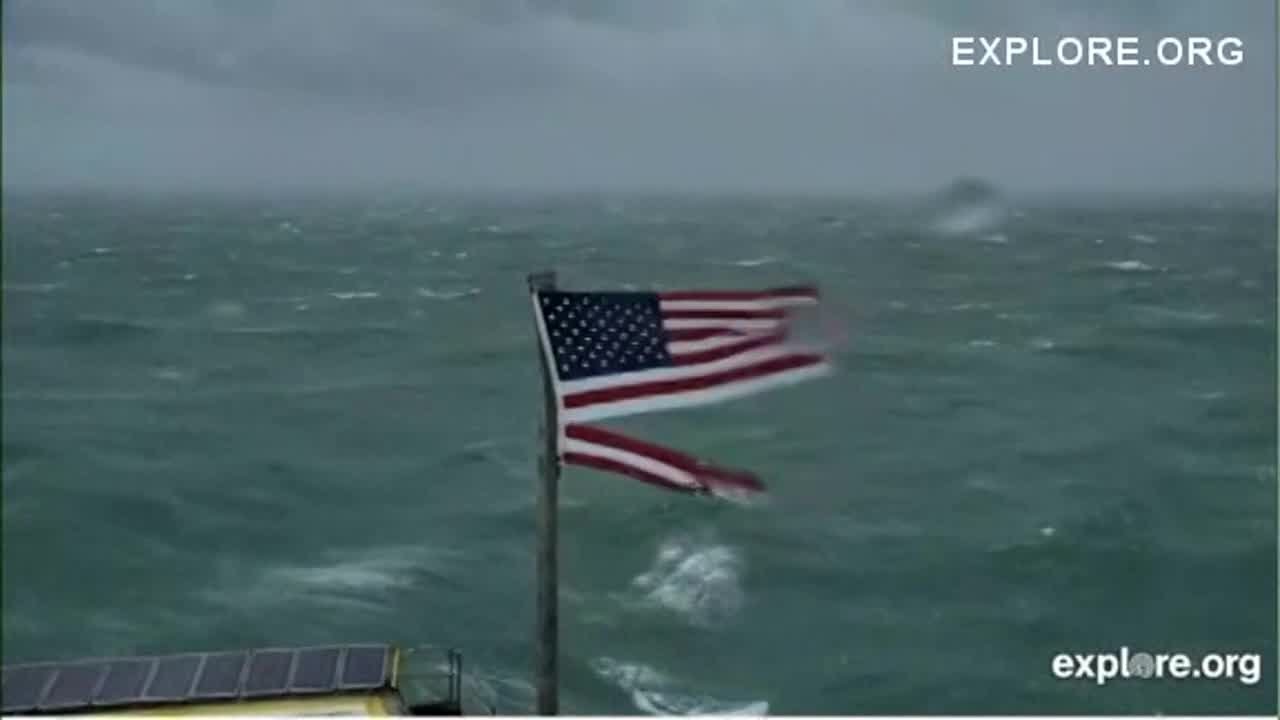 US flag ripped by Hurricane Florence while flying above Frying Pan ...